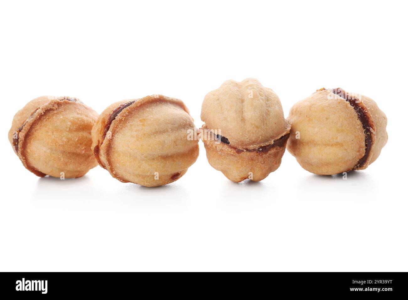 Many sweet walnut shaped cookies with boiled condensed milk on white ...