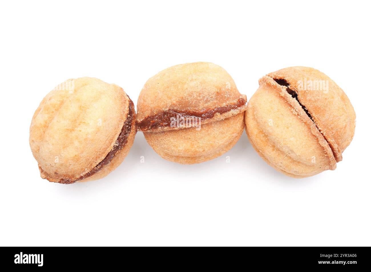 Sweet walnut shaped cookies with boiled condensed milk on white ...