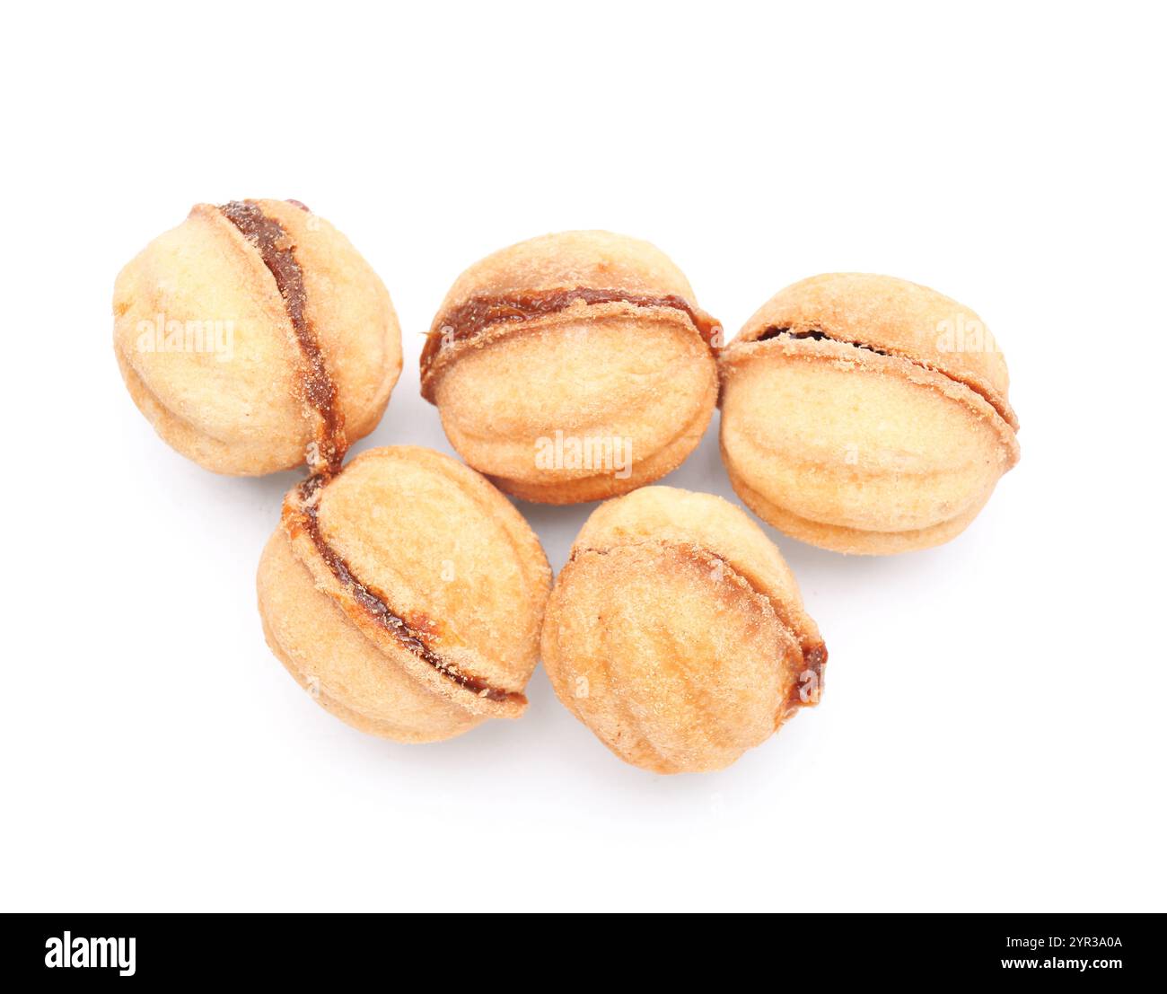 Many sweet walnut shaped cookies with boiled condensed milk on white ...