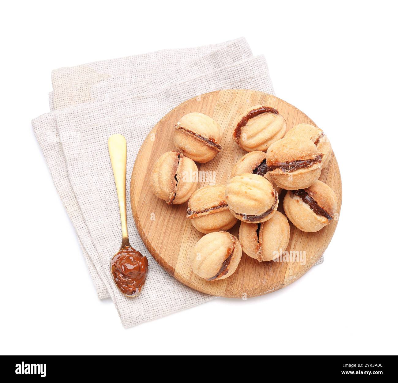 Wooden board of sweet walnut shaped cookies with boiled condensed milk ...