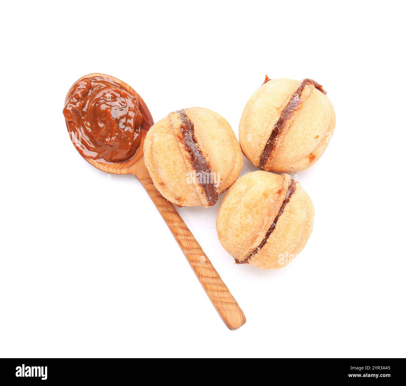 Sweet walnut shaped cookies with boiled condensed milk on white ...