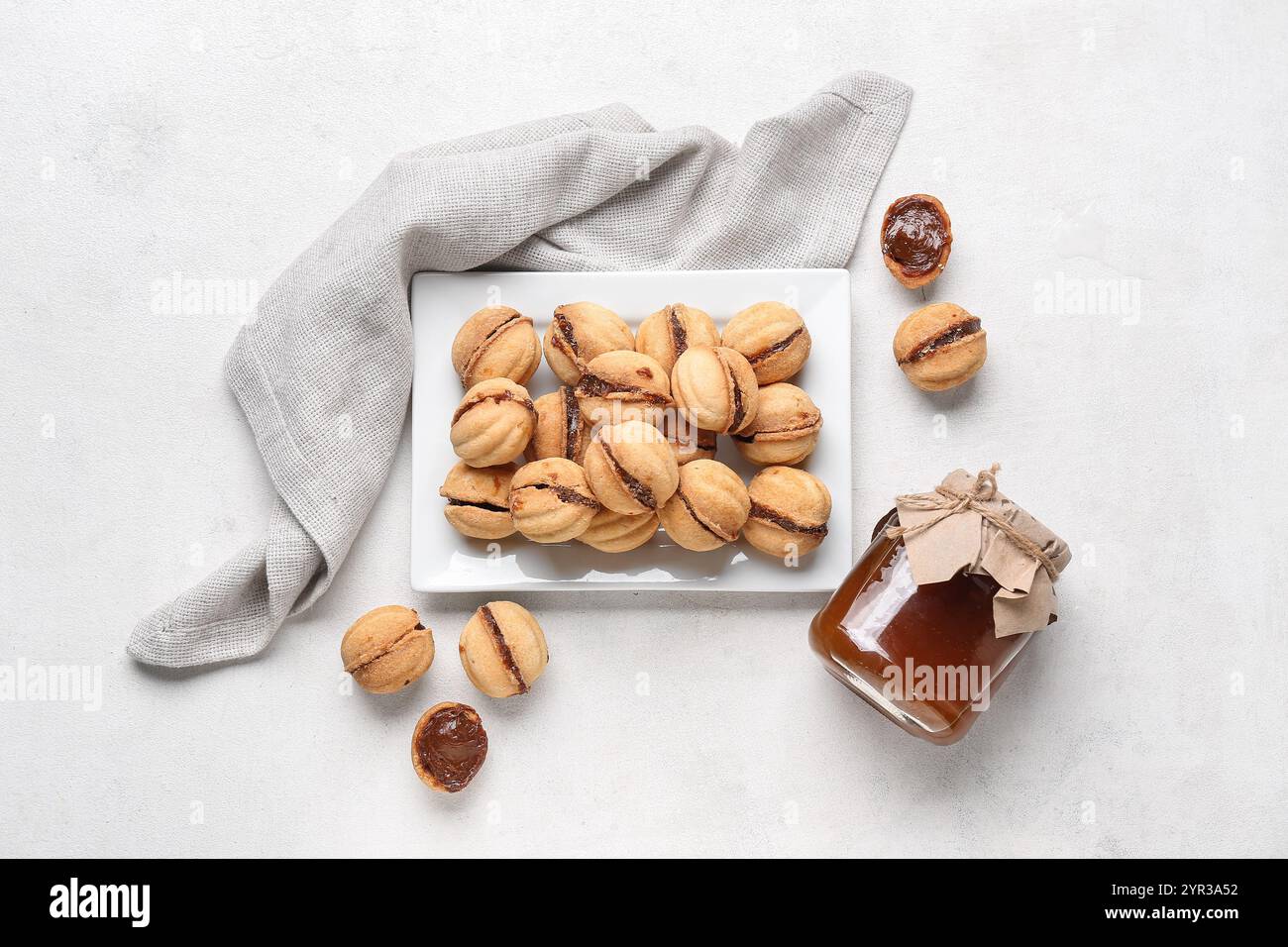 Plate with sweet walnut shaped cookies with boiled condensed milk on ...