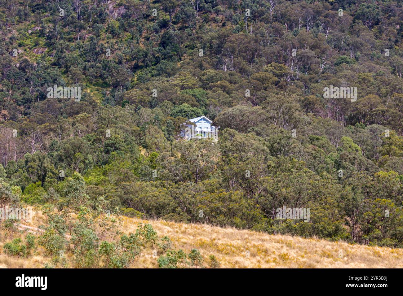 Photograph of a two storey house in a very remote location on the side ...
