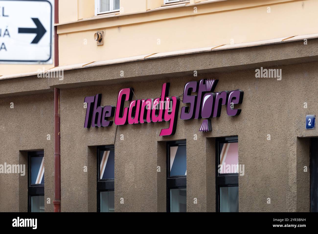 The Candy Store logo sign of the retailer on a building wall ...
