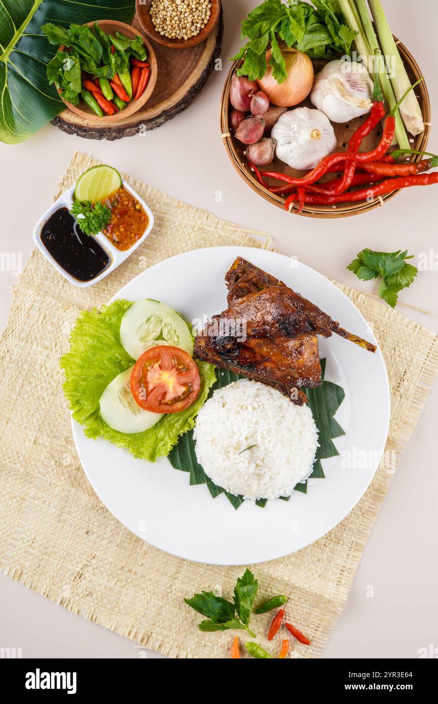 Bebek Bakar or Roasted duck with Sambal Terasi, a traditional food from ...