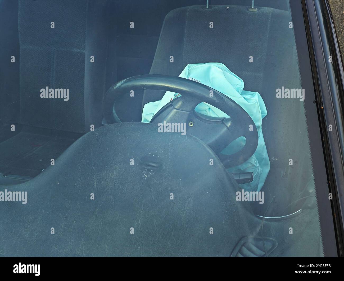 Exploded airbag in SUV car. Wrecked car with opened airbags after ...