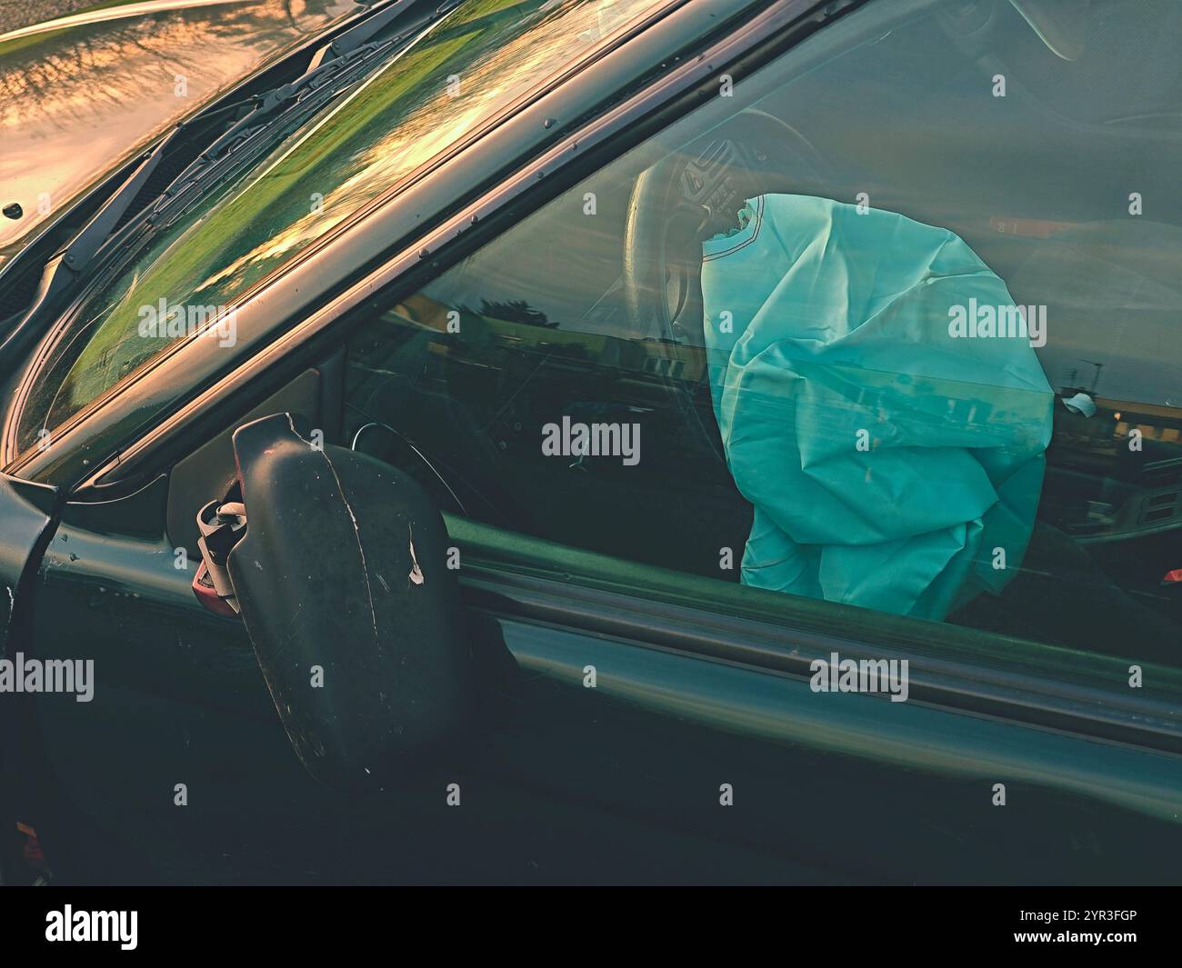 Exploded airbag in SUV car. Wrecked car with opened airbags after ...