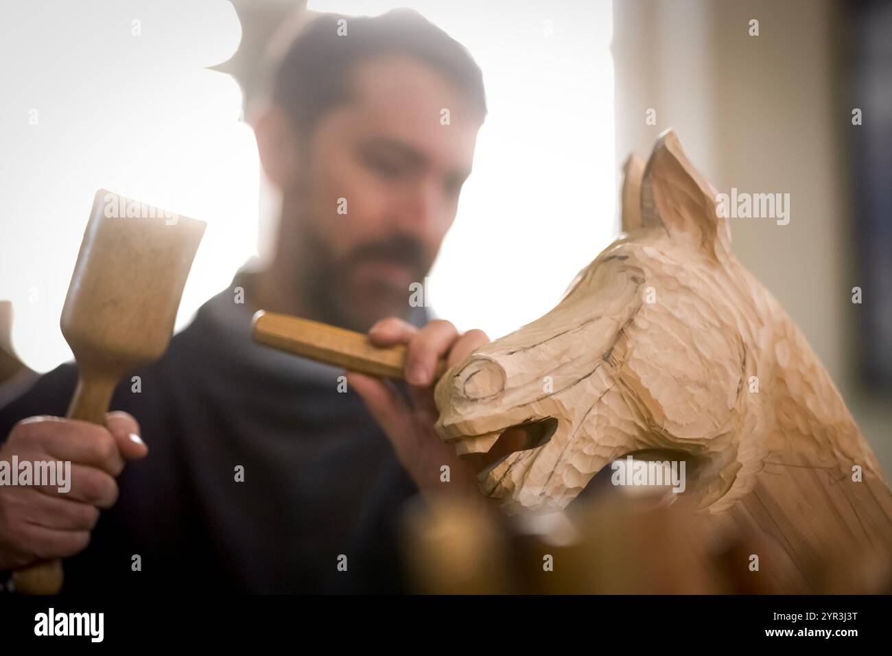 29/11/24 Pete Rix carves a horse’s head from tulipwood. The wood block ...
