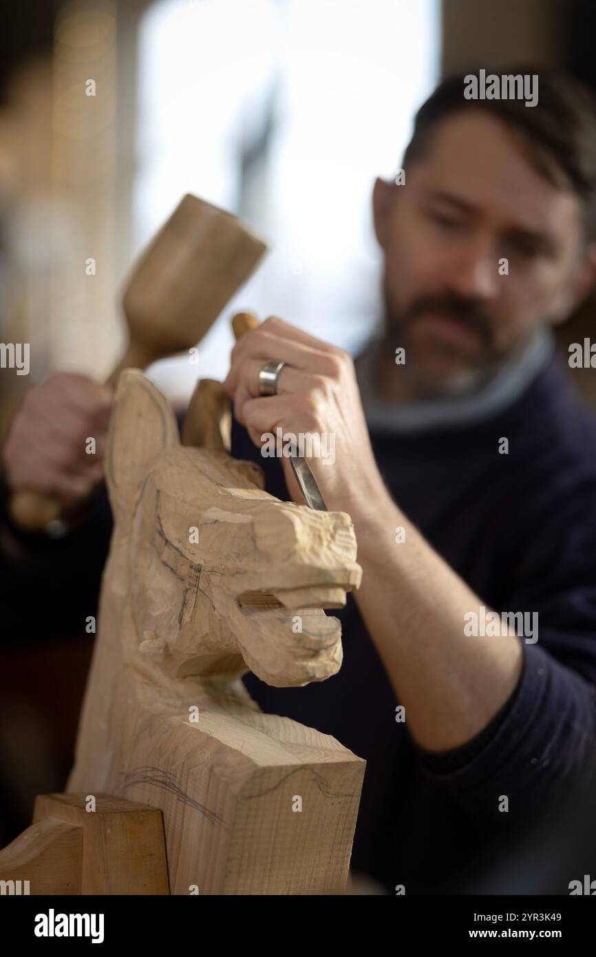 29/11/24 Pete Rix carves a horse’s head from tulipwood. The wood block ...