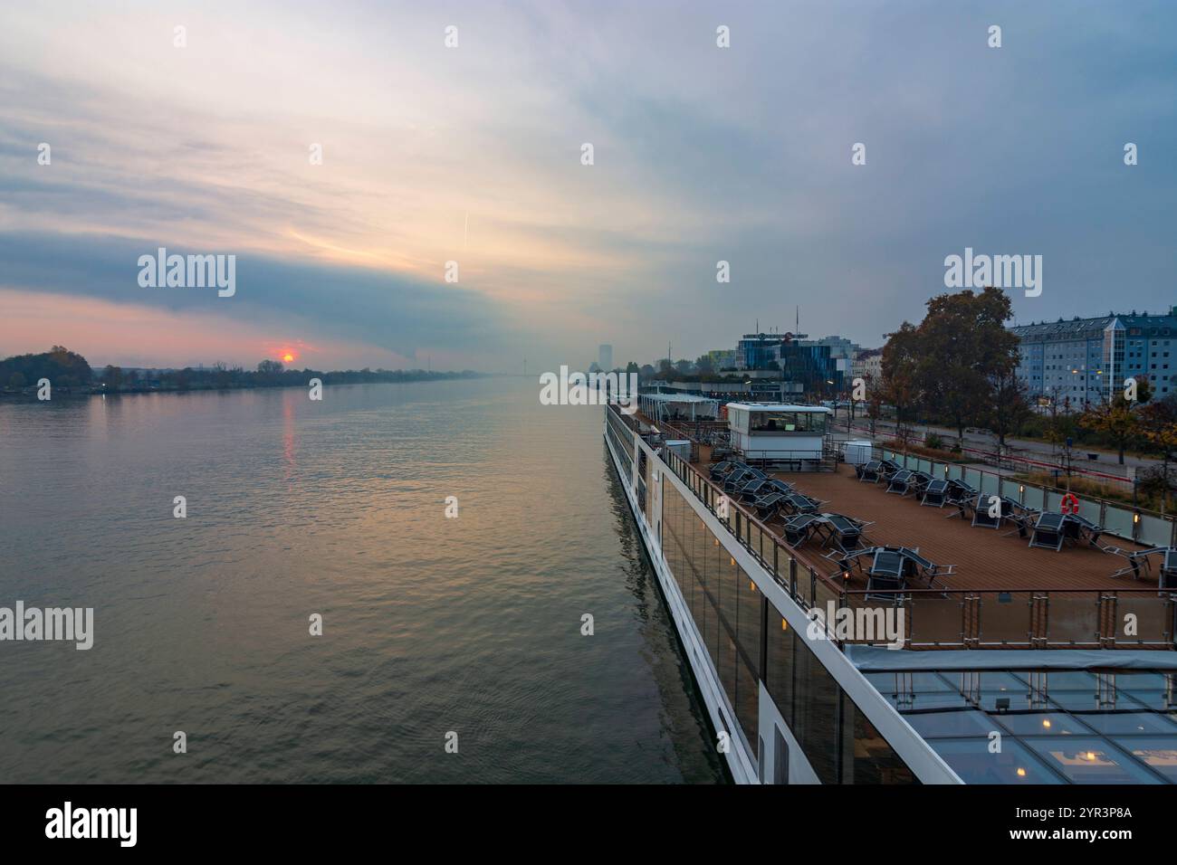 sunrise at river Donau Danube, mist, cruise ship at jetty Reichsbrücke ...