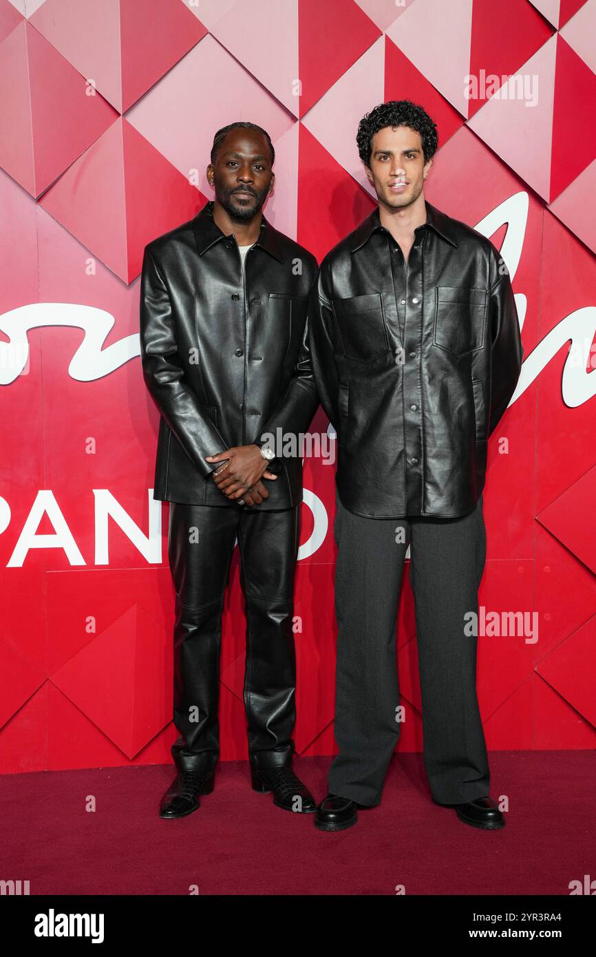 Emmanuel Lawal, left and Ashton Gohil pose for photographers upon ...