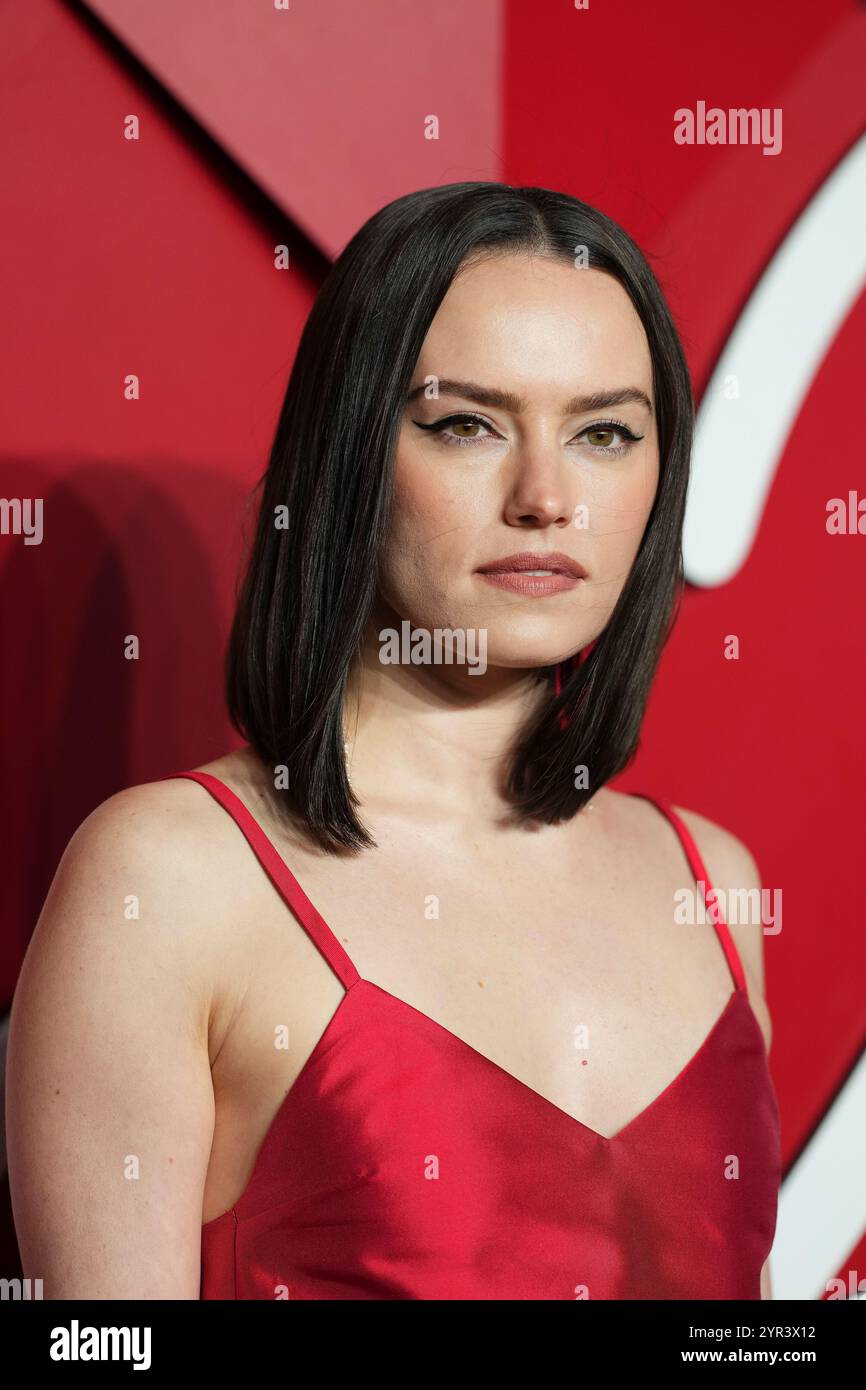 Daisy Ridley poses for photographers upon arrival at the The Fashion ...
