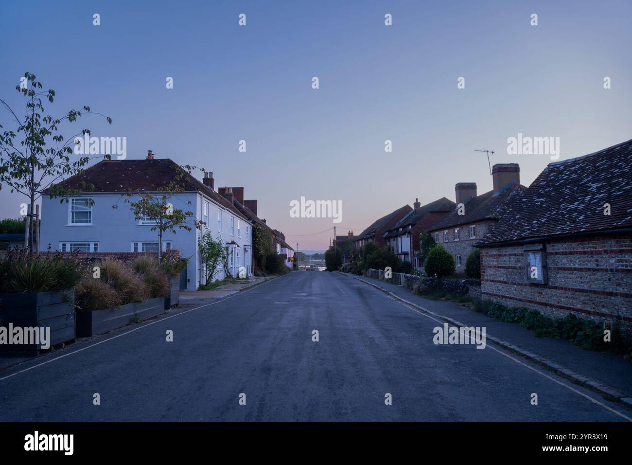 Empty main street of West Itchenor village in Chichester, England, at ...