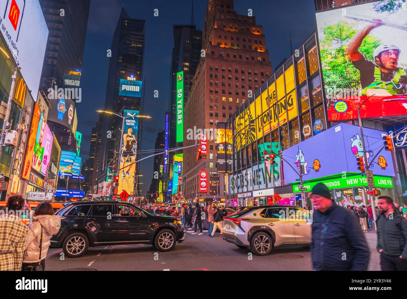 Vibrant view of Times Square at night with colorful digital billboards ...