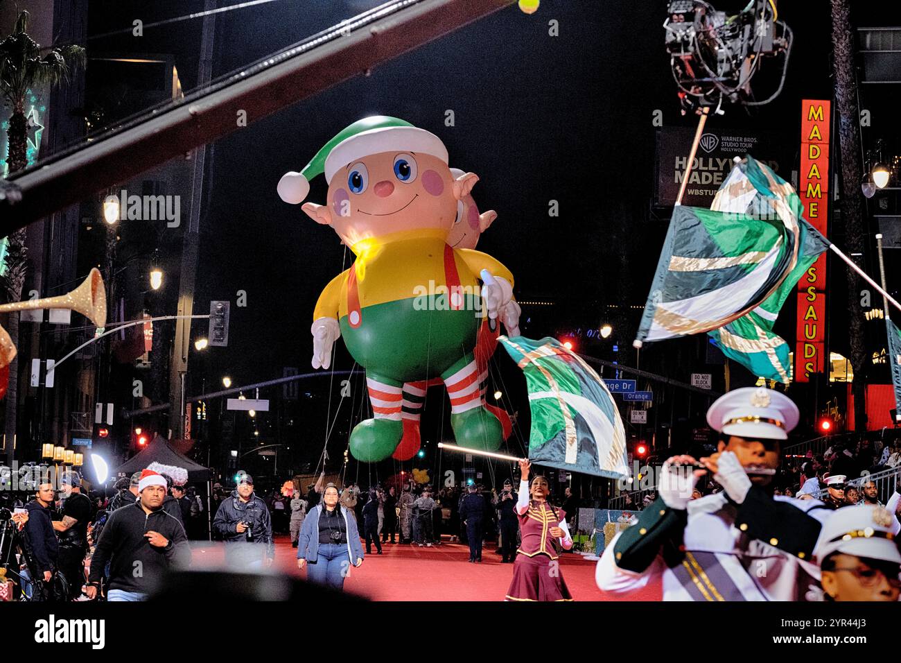 Giant Santa Elves balloons are paraded down Hollywood Blvd. during the ...
