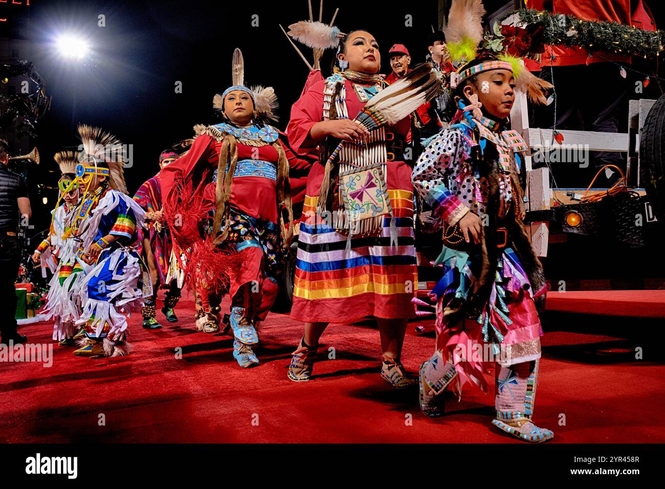 Native American children dance along Hollywood Blvd. while ...