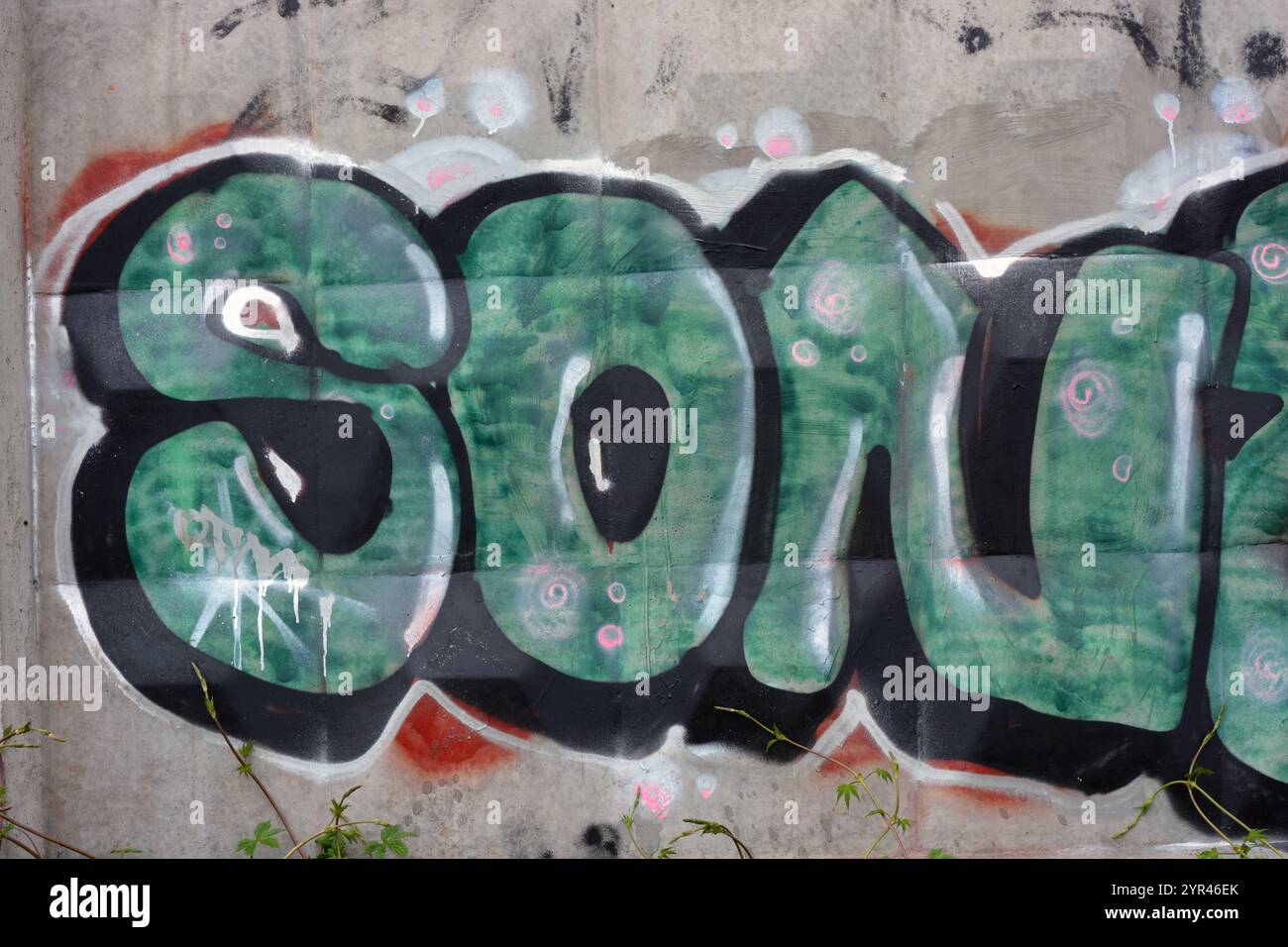 Green letters and white lines with thick black borders. A drawing ...
