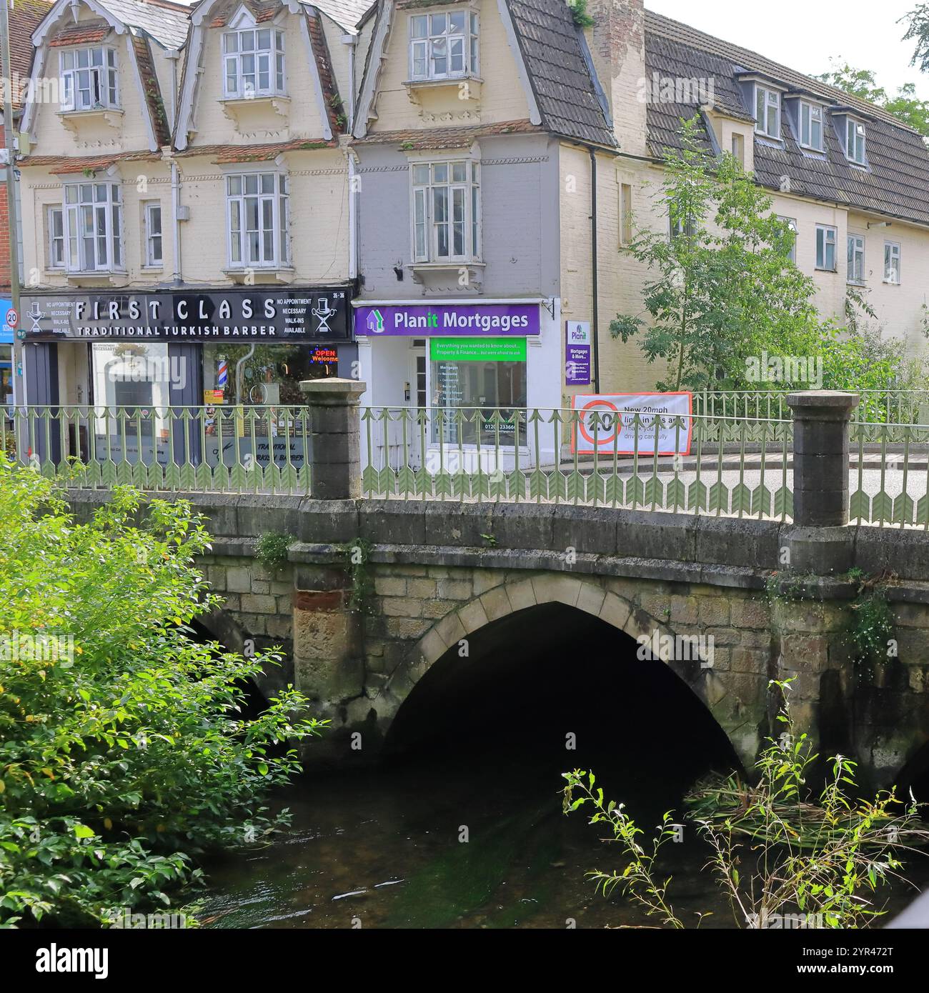 Wimborne Minster, Dorset, England. 4 October 2024. An arched bridge ...