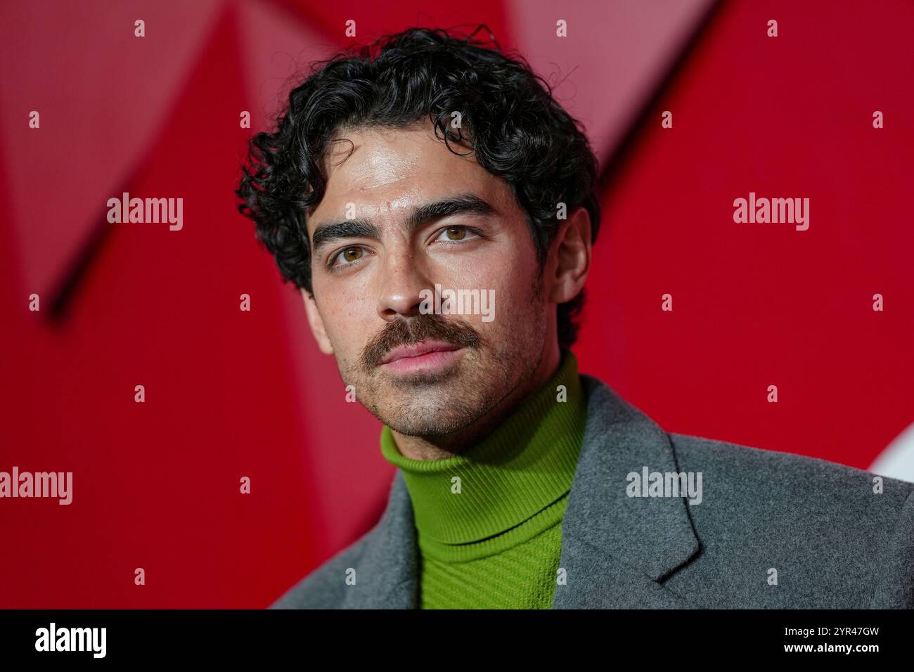 Joe Jonas poses for photographers upon arrival at the The Fashion ...