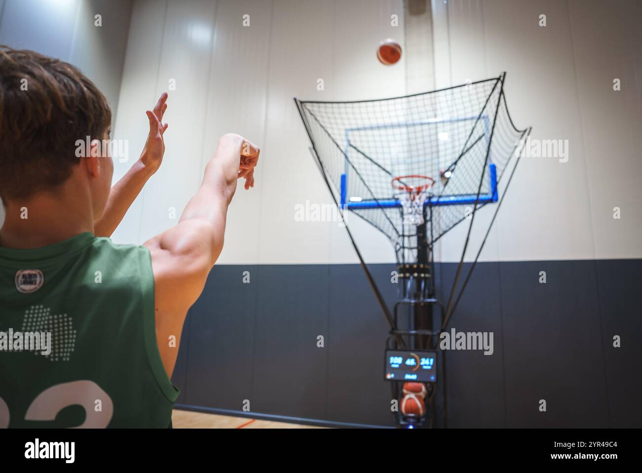 Indoor Basketball Court with Modern Training Equipment and Player Stock ...