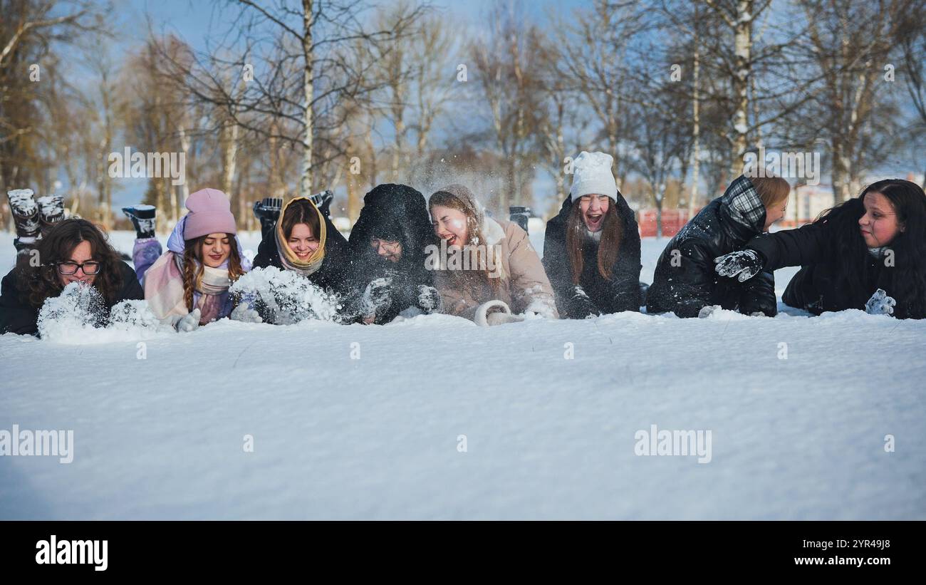Teenagers playing in snow hi-res stock photography and images - Alamy