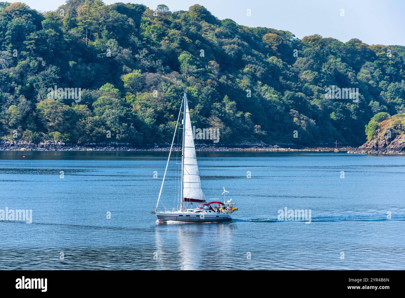 Yacht motoring on the Sound of Mull near Tobermory on the Isle of Mull ...