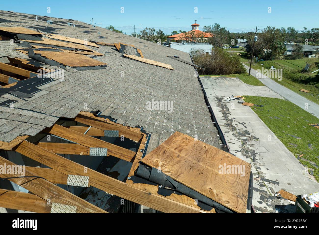 Consequences of natural disaster. Damaged house roof with missing ...