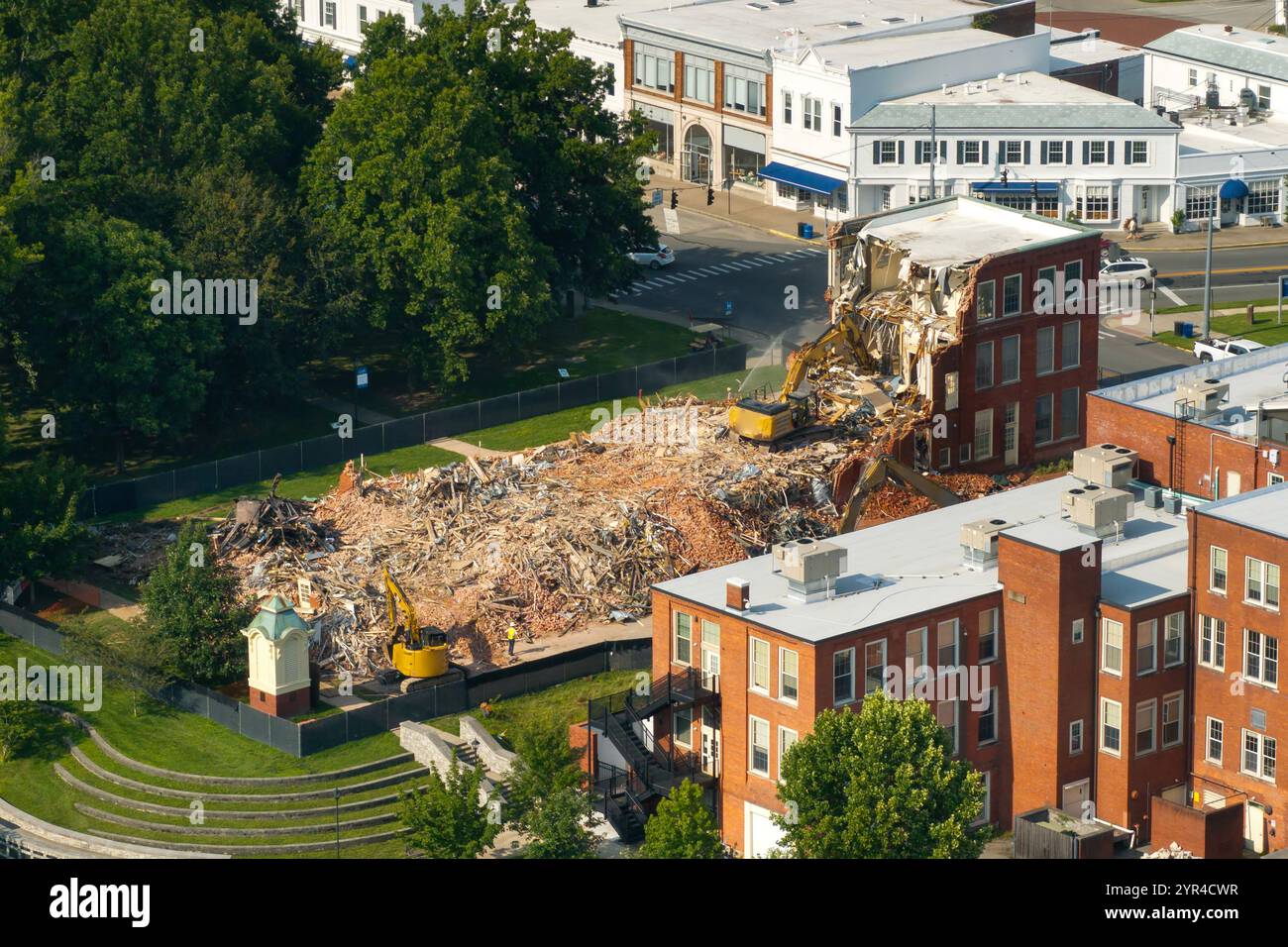 Old building demolition site. Construction excavator tearing down ...