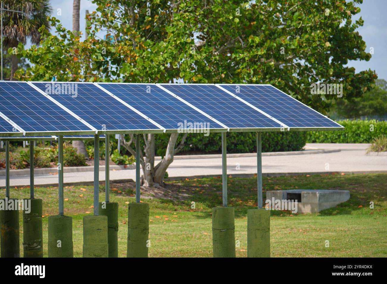 Solar panels installed on stand frame near parking lot for effective ...