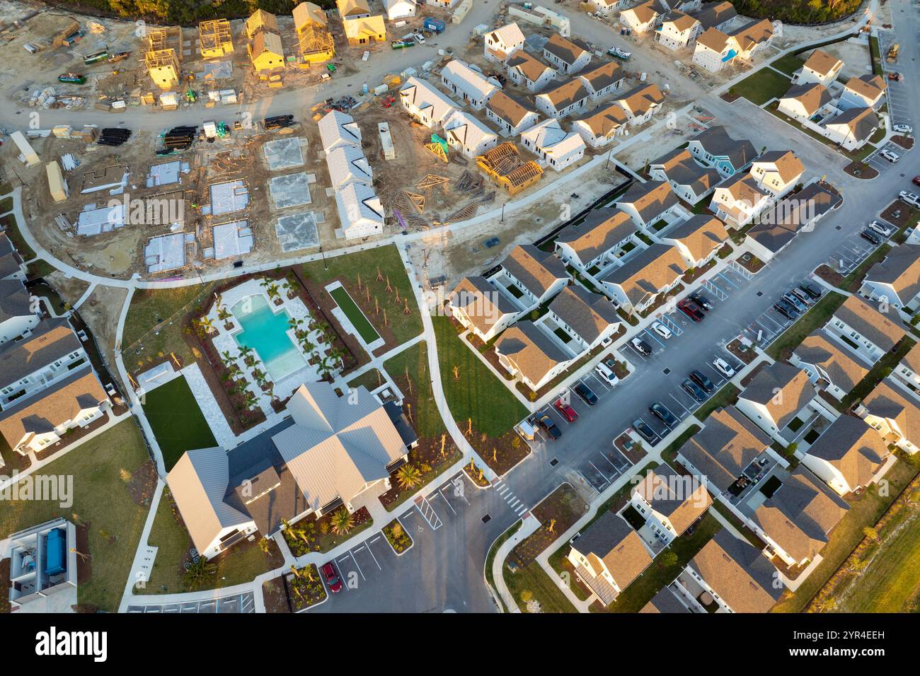 Wooden houses under construction in new developing suburban area ...