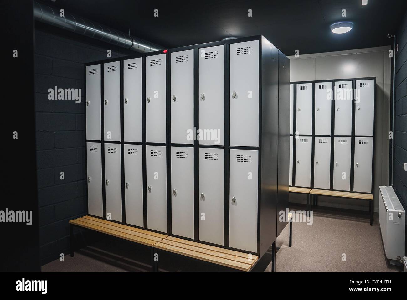 Modern Locker Room with Metallic Lockers and Wooden Benches Stock Photo ...