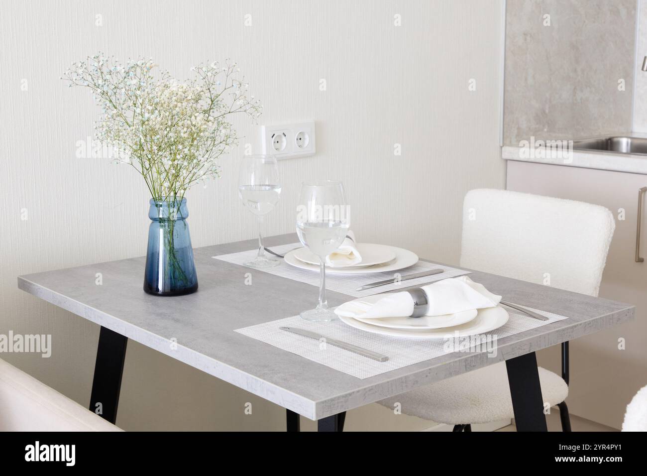 An Elegant and Modern Dining Table Setup that Features a Beautiful ...
