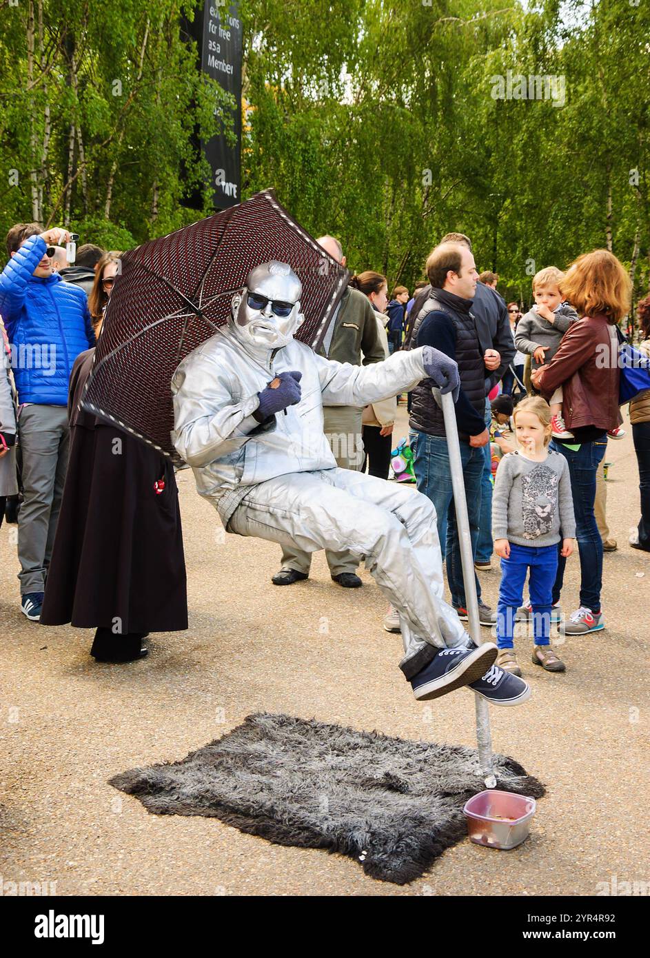 LONDON, ENGLAND, UK - MAY 3, 2014: Unidentified floating man in silver ...