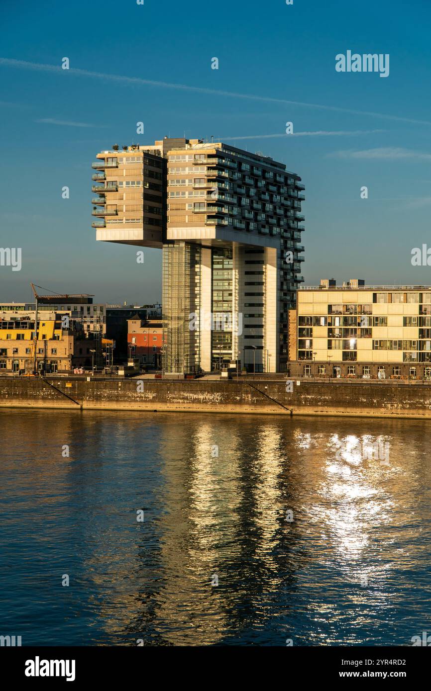 Modern riverside building with a unique architectural design reflects ...