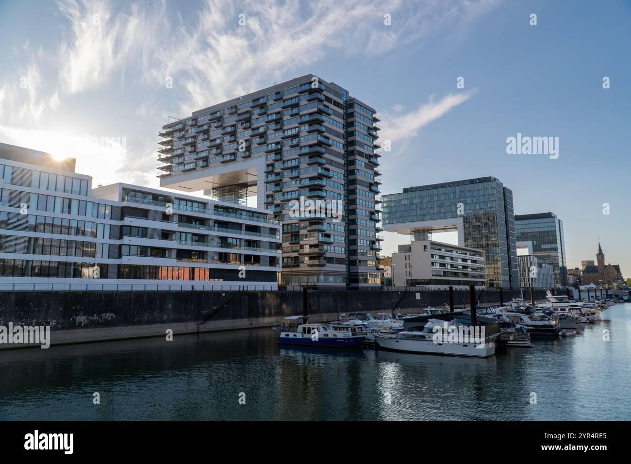 Modern riverside building with a unique architectural design reflects ...