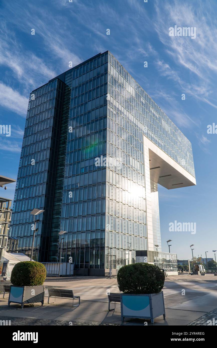 Modern riverside building with a unique architectural design reflects ...