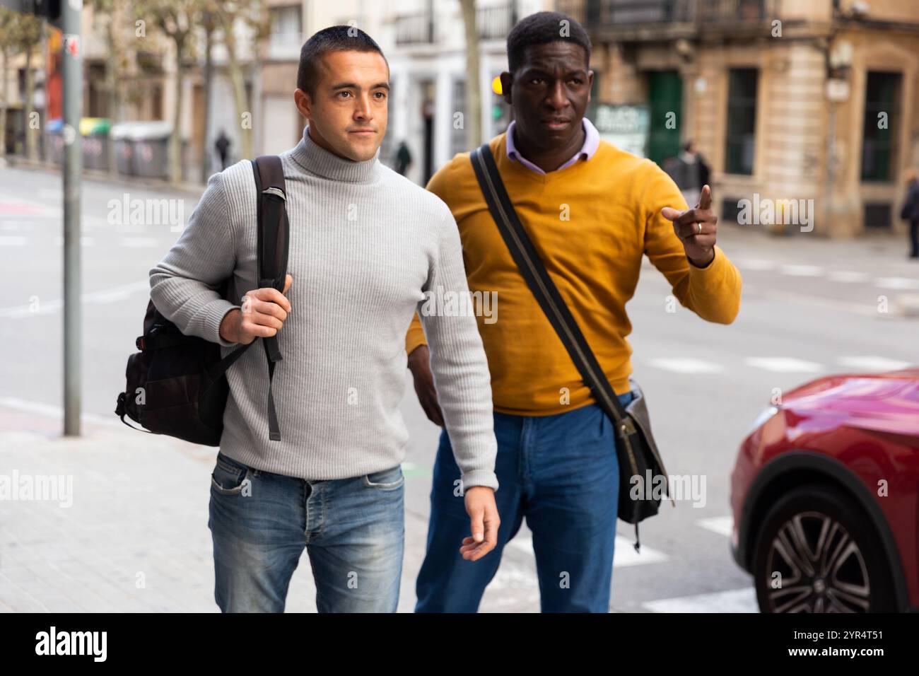 Men walking through city streets Stock Photo - Alamy
