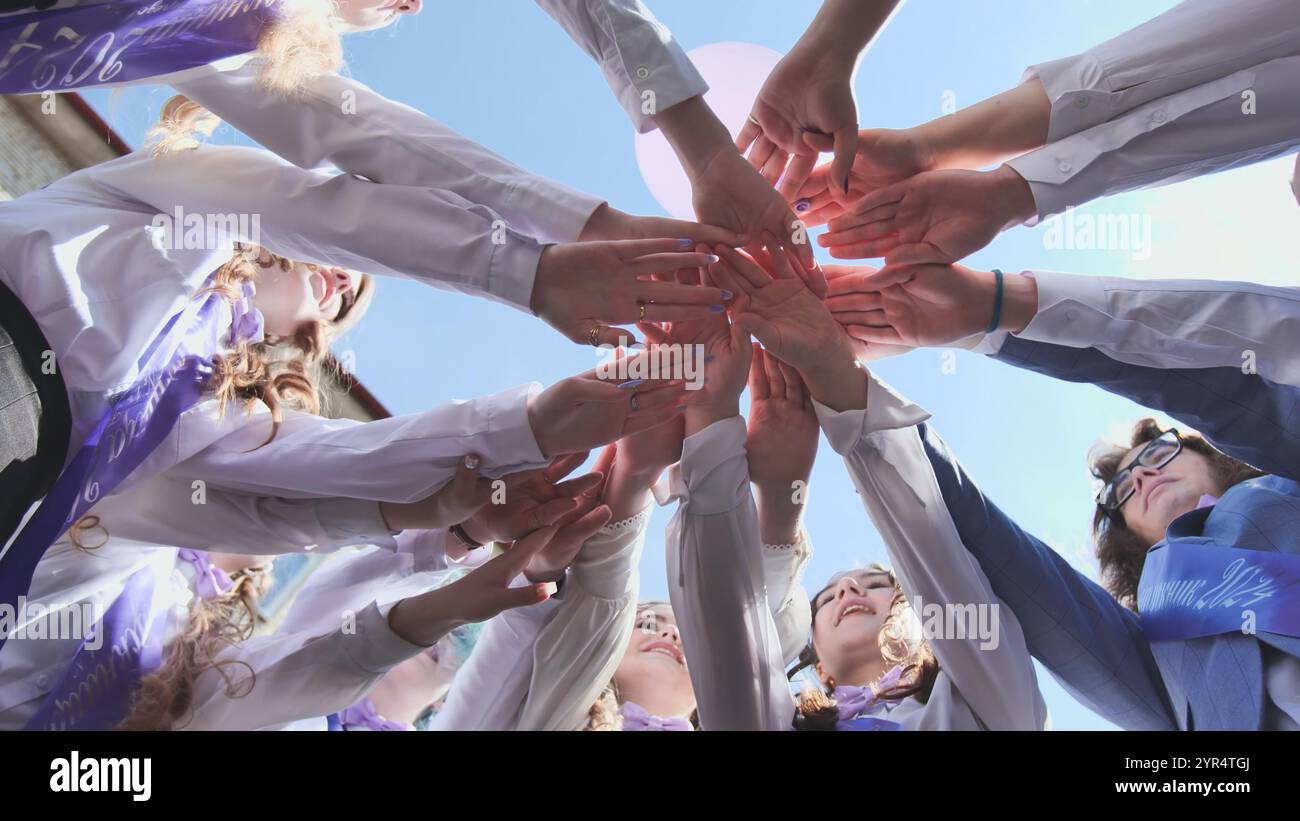 Students come together in a circle to celebrate their final school day ...