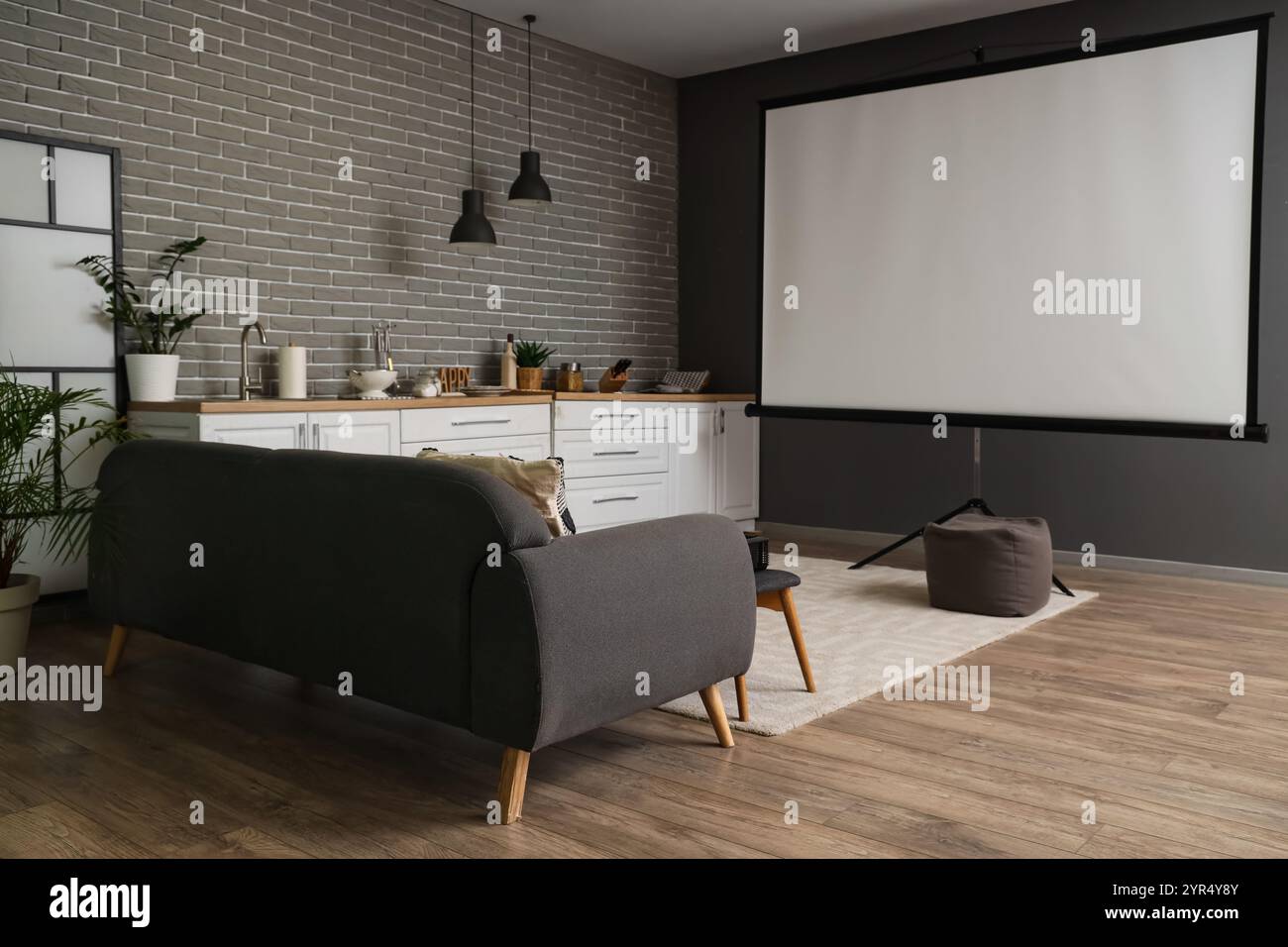 Interior of kitchen with counters, sofa and projector screen Stock ...