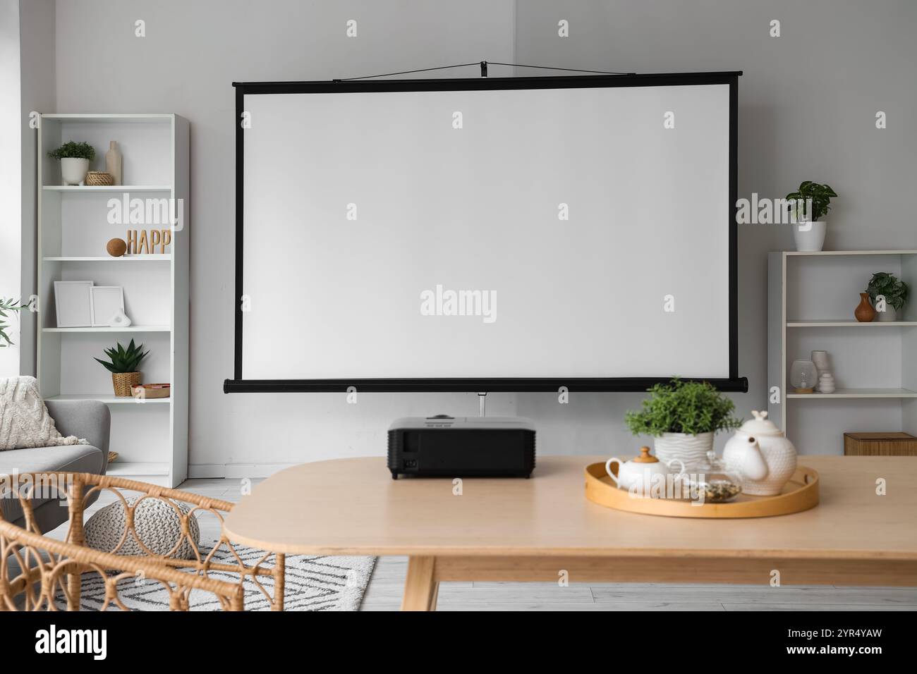 Interior of light room with projector screen and dining table Stock ...