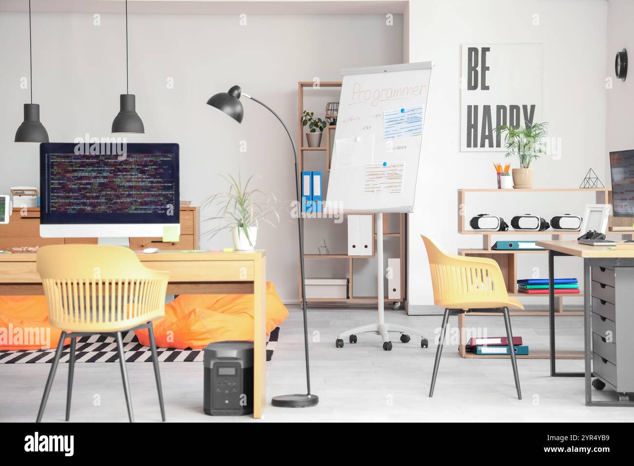 Interior of light programmer's office with desks and beanbags Stock ...