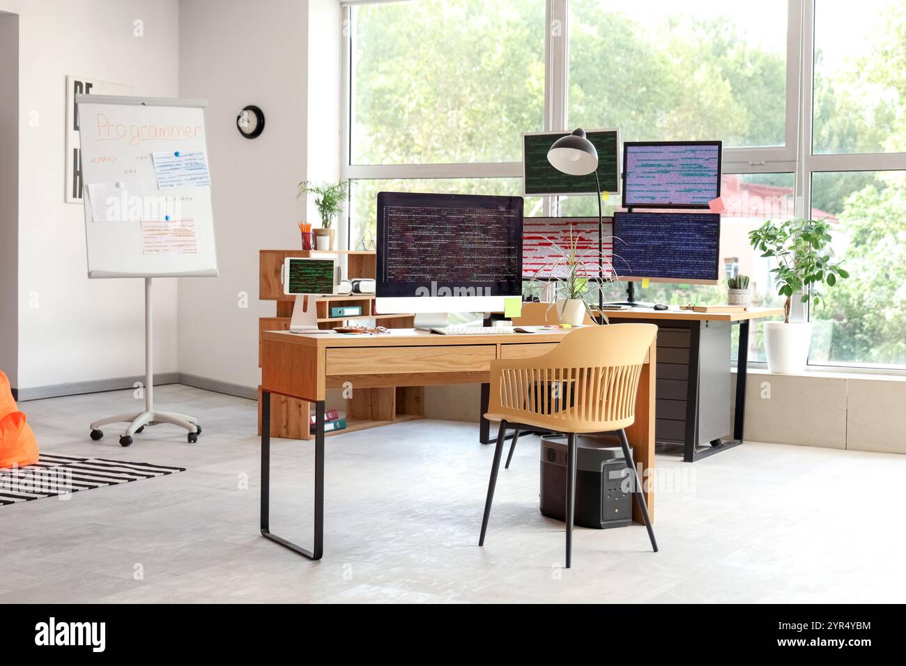 Interior of light programmer's office with desks and flipchart Stock ...