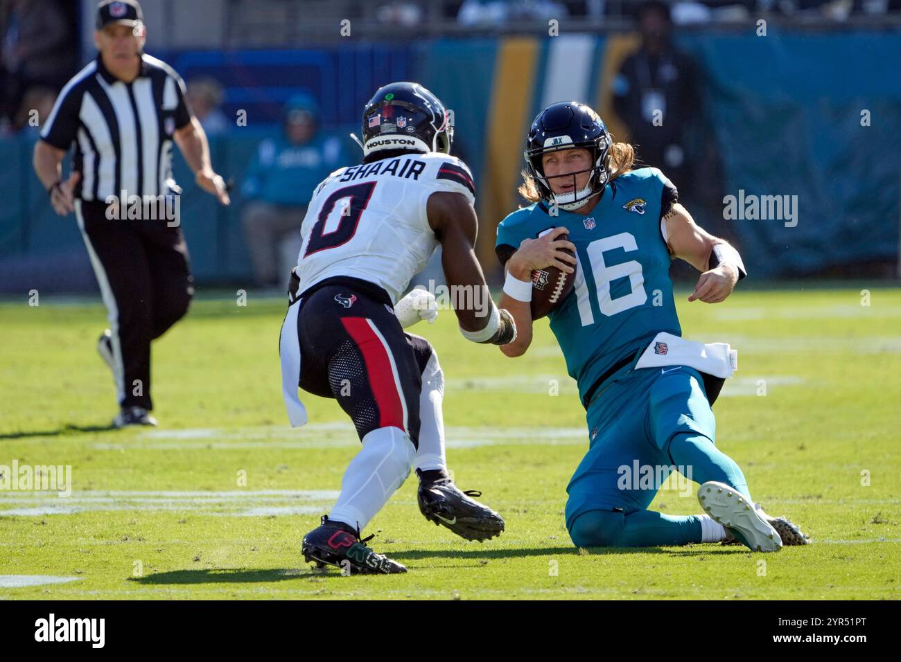 Jacksonville Jaguars quarterback Trevor Lawrence (16) begins to slide ...