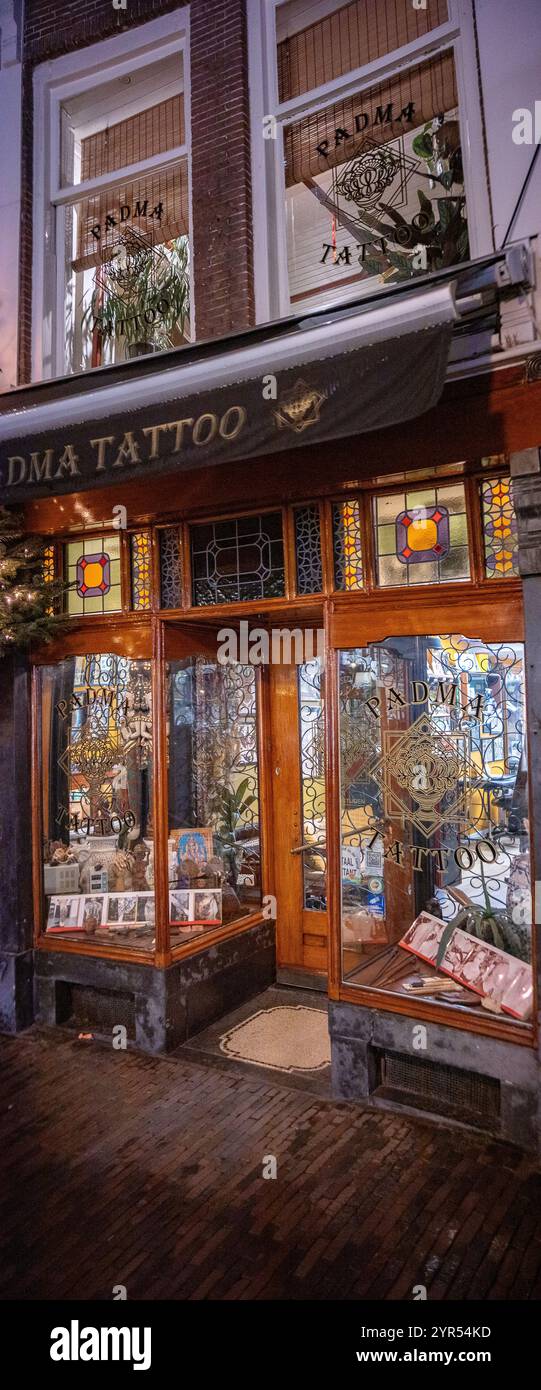 Cozy ambience exterior tattoo shop facade in Dutch city center Stock ...
