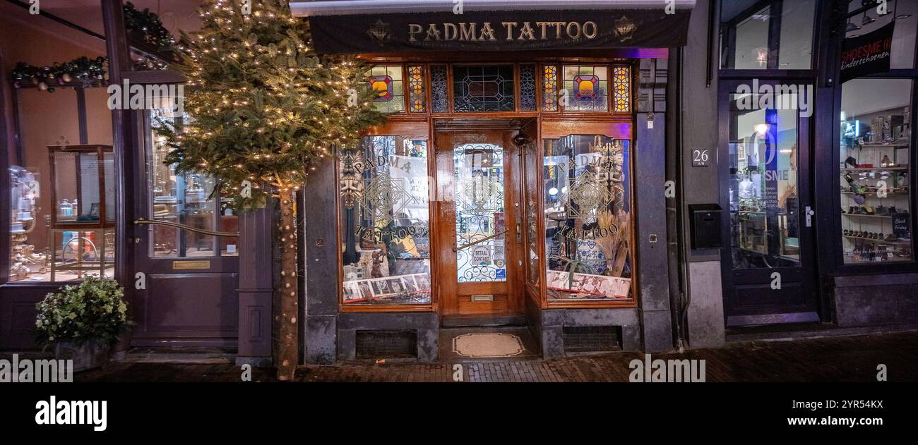 Cozy ambience exterior tattoo shop facade in Dutch city center Stock ...