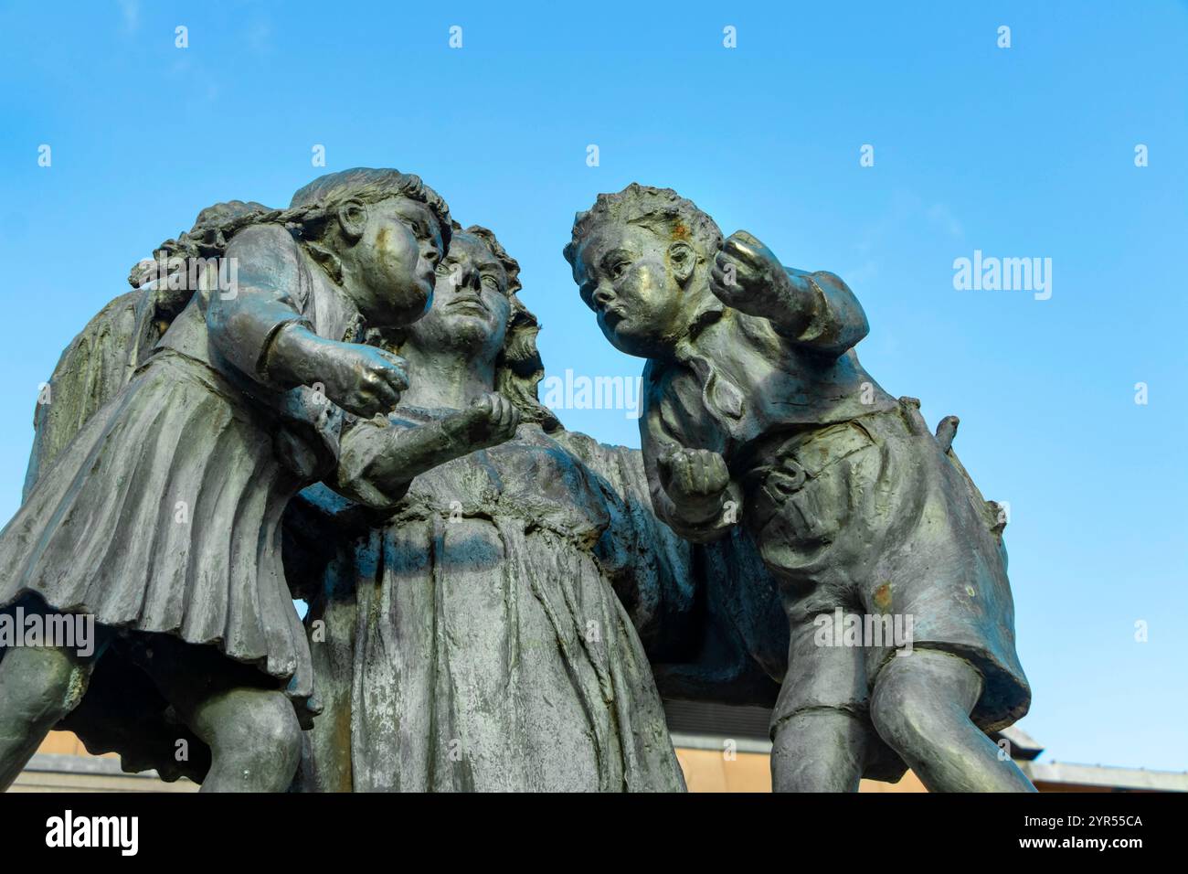 Statue depicting scales of justice with woman holding two quarreling ...