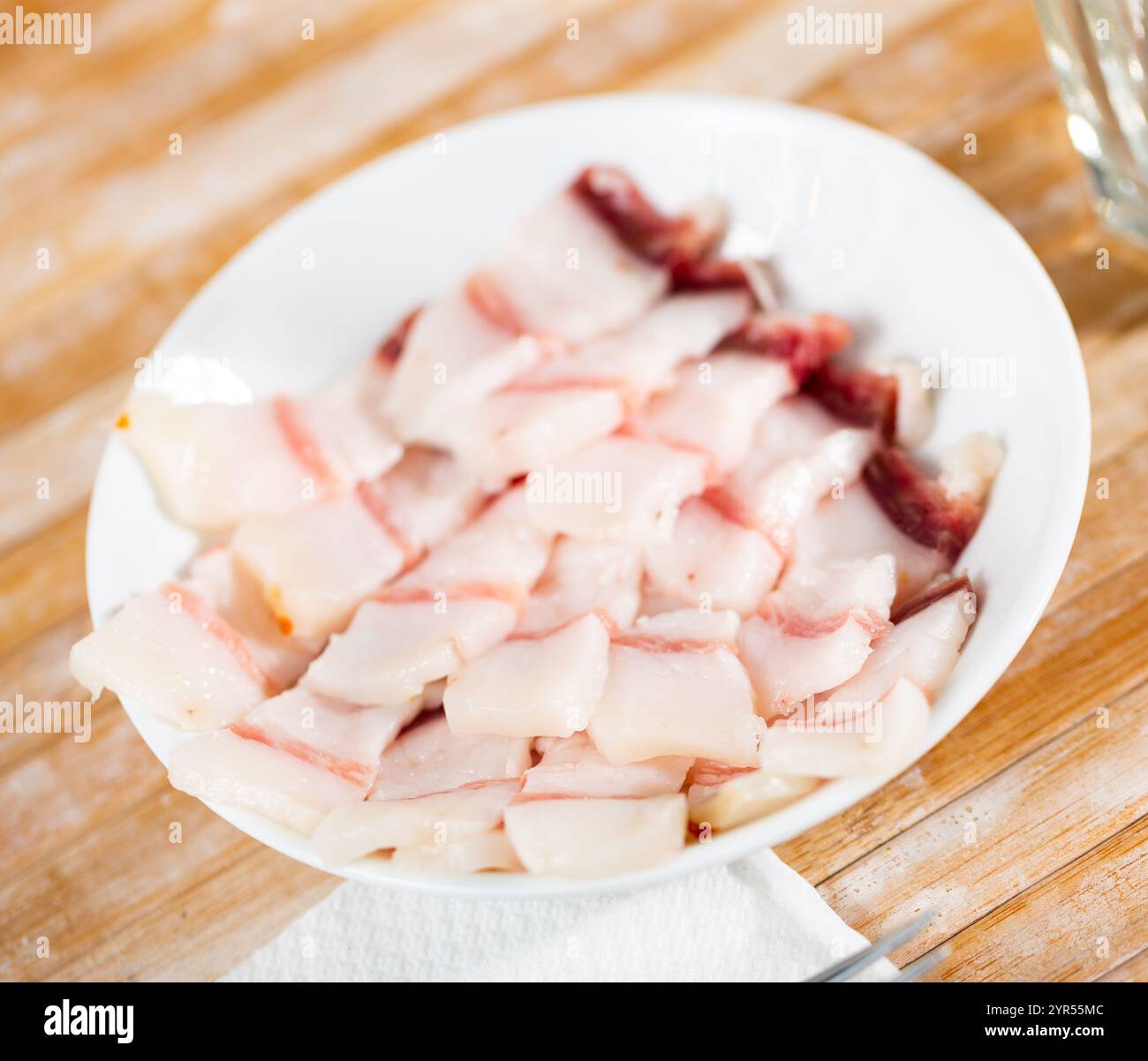 Plate of sliced salted salo with layers of meat Stock Photo - Alamy