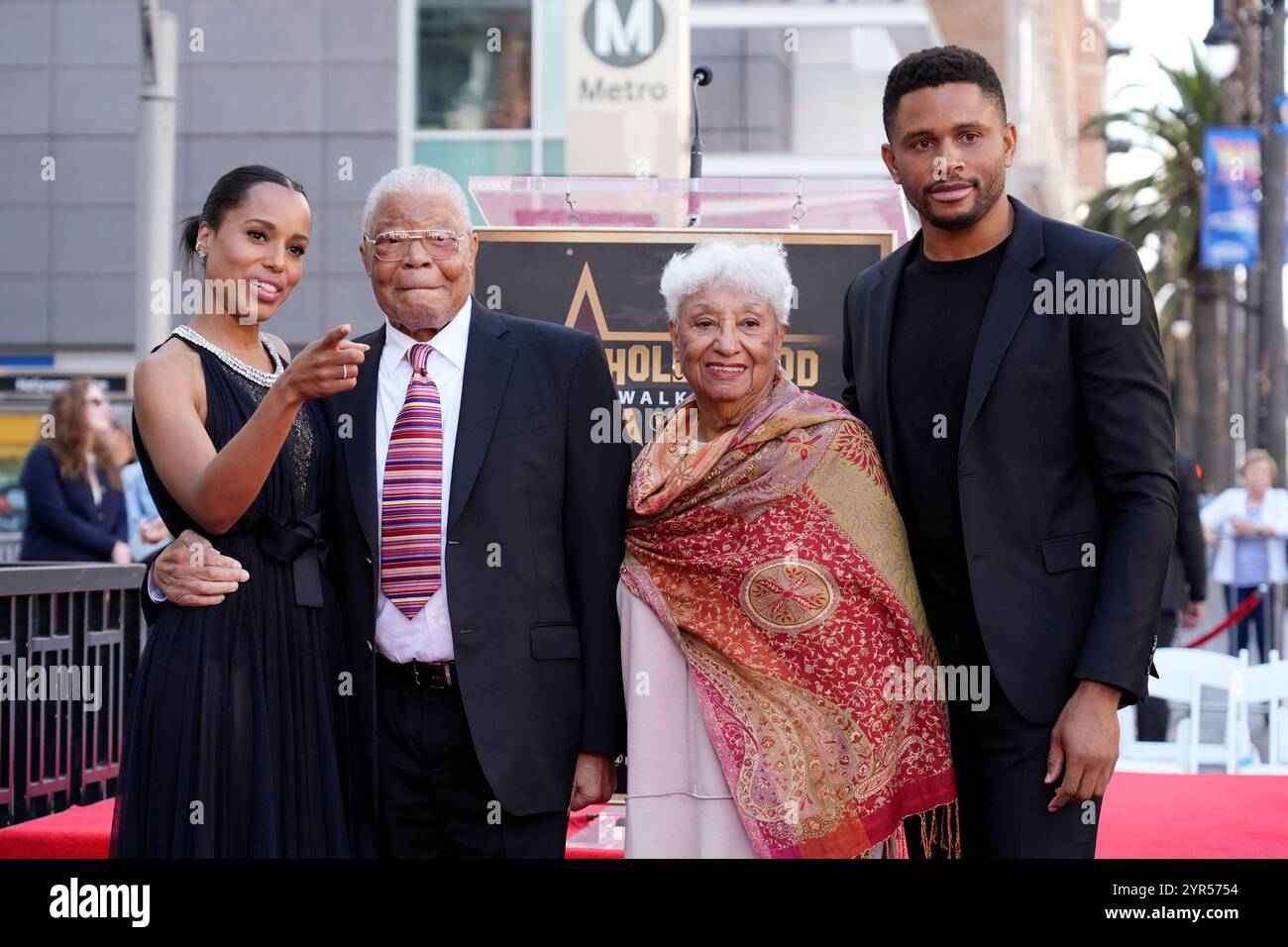 Actor Kerry Washington, left, poses with, her father Earl, from second ...