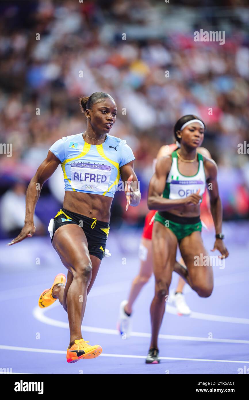 Julien Alfred participating in the 200 meters relay at the Paris 2024 ...