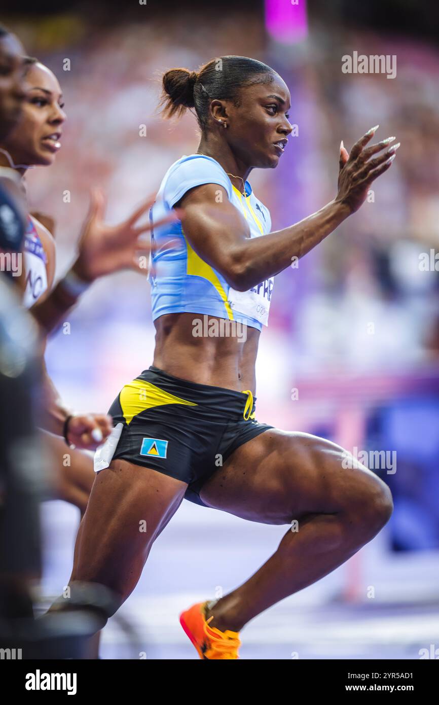 Julien Alfred participating in the 200 meters relay at the Paris 2024 ...